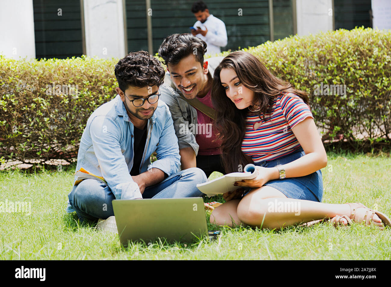 Three College Boys And Girl Students Friends Studying Book With Laptop ...