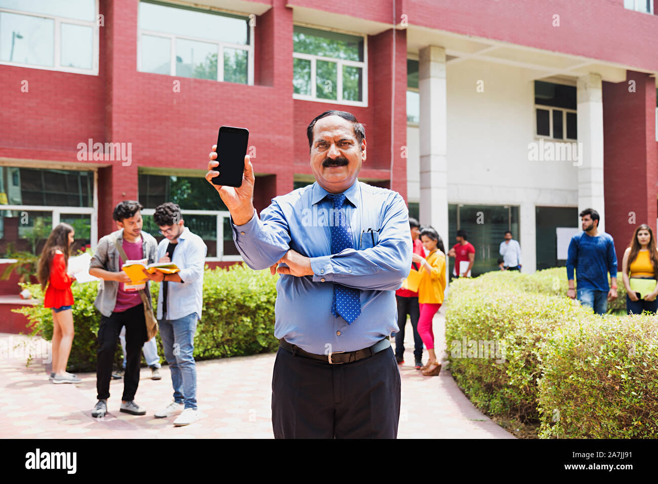 Senior man College Teacher Showing Mobile-Phone With Students-In-The ...