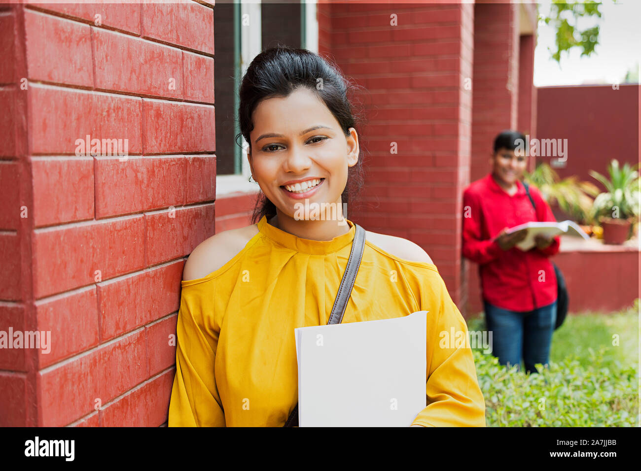 Indian college girl with holding bag hi-res stock photography and ...