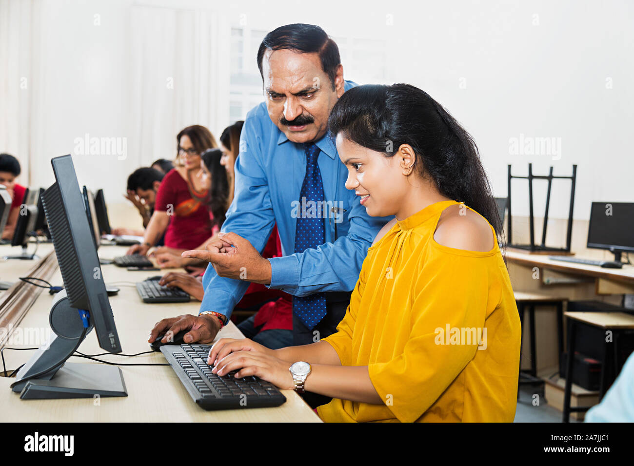 Teacher Helping College Girl Student with computer lesson Studying ...