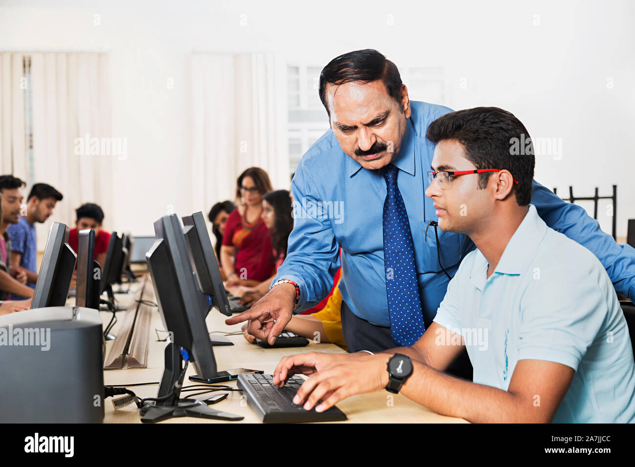 Indian College Boy Student With Teacher Studying Pointing Computer ...