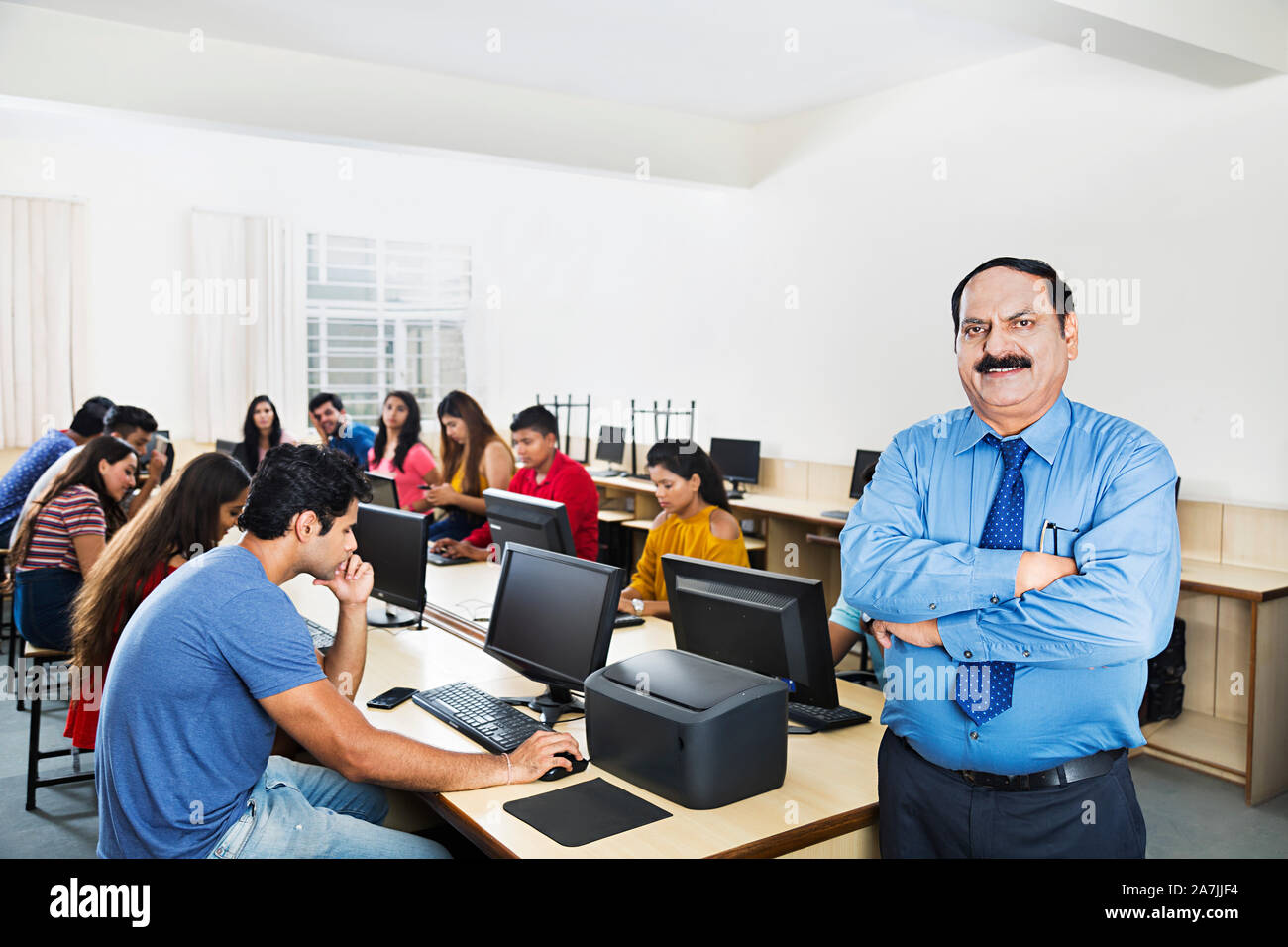 Senior Man College Professor With Arms-Folded Standing With Students ...