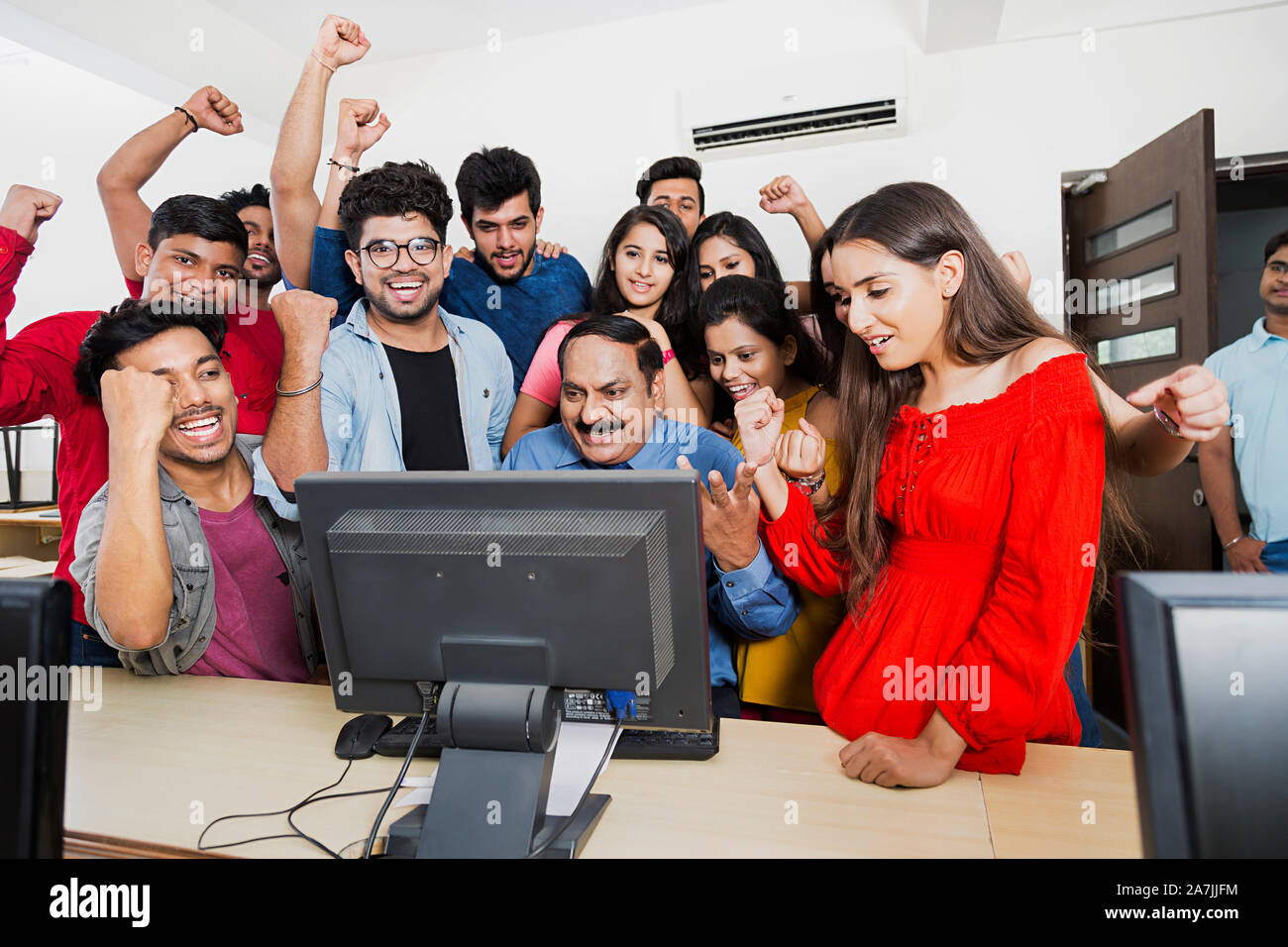 Group Of College Boys And Girls Students With Teacher Studying Computer ...