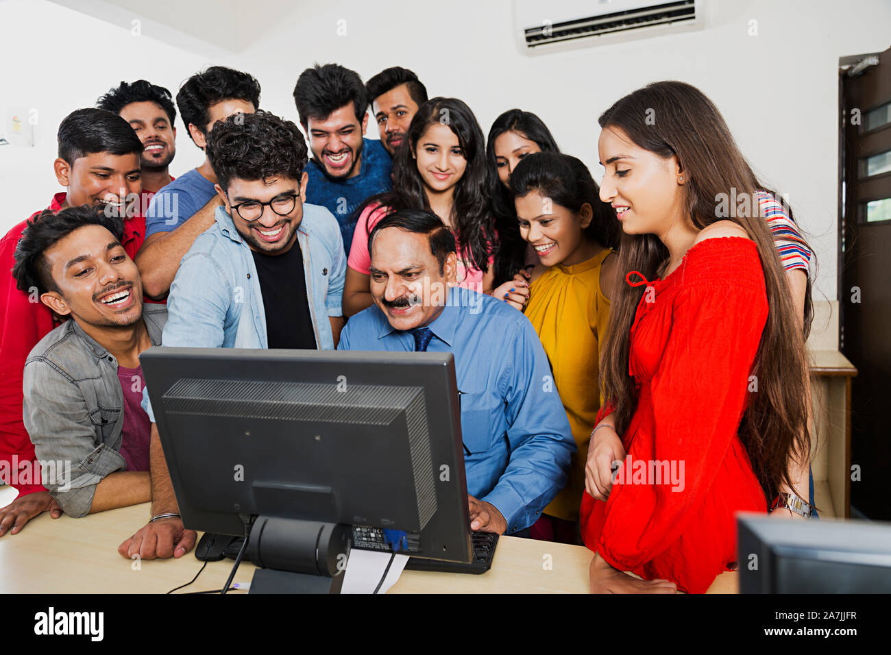 Group College Students With Professor Studying Computer E-Learning At ... Group College Students With Professor Studying Computer E-Learning At ...