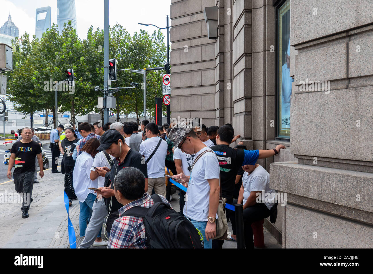 Customers queue up in front of a pop-up store of Machi Machi, which is ...