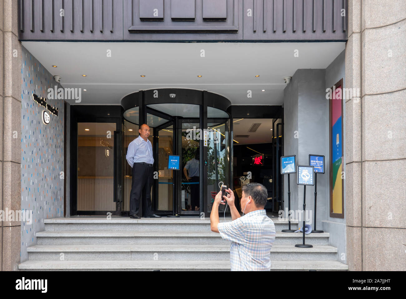 Customers queue up in front of a pop-up store of Machi Machi, which is ...