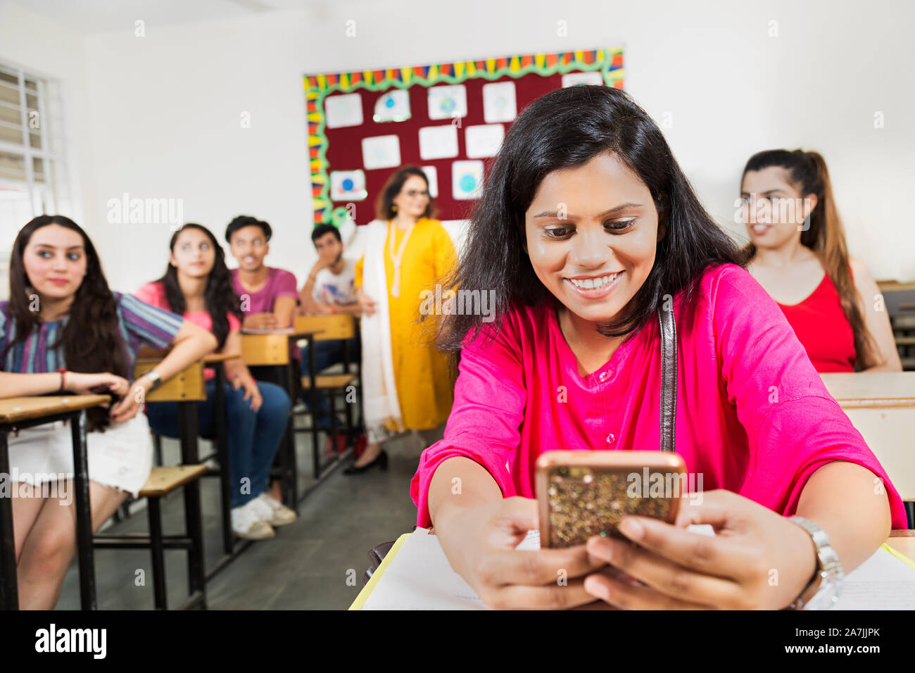 Young Woman College Student Reading Text-Messaging Cellphone With ...