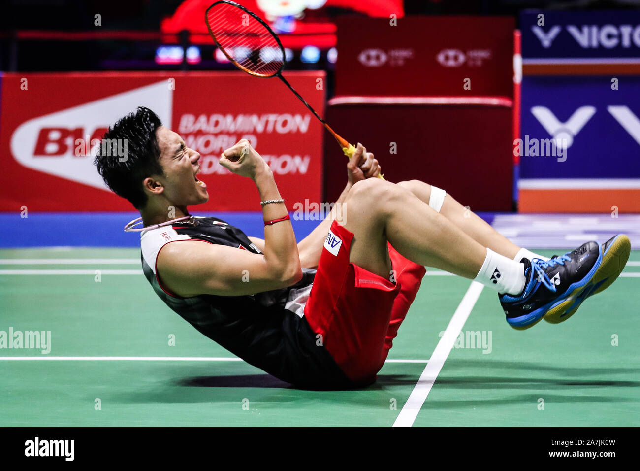 Japanese professional badminton player Kento Momota competes against ...