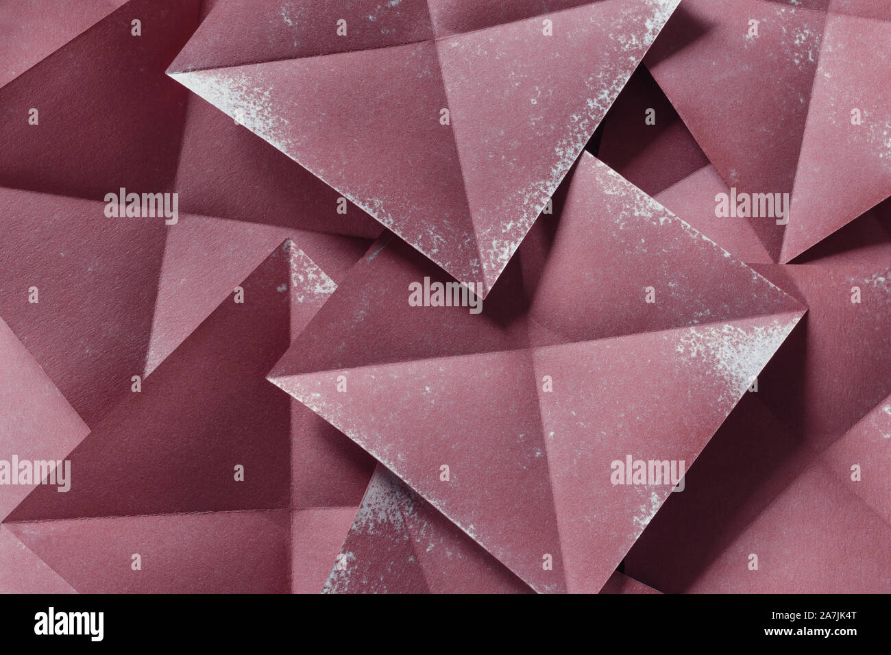 Red paper folded in geometric shapes, abstract background Stock Photo ...