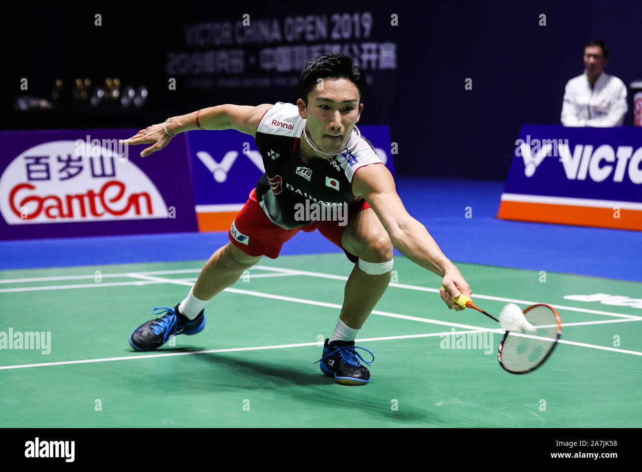 Japanese professional badminton player Kento Momota competes against ...
