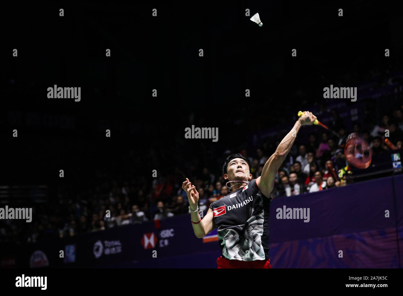 Japanese professional badminton player Kento Momota competes against ...