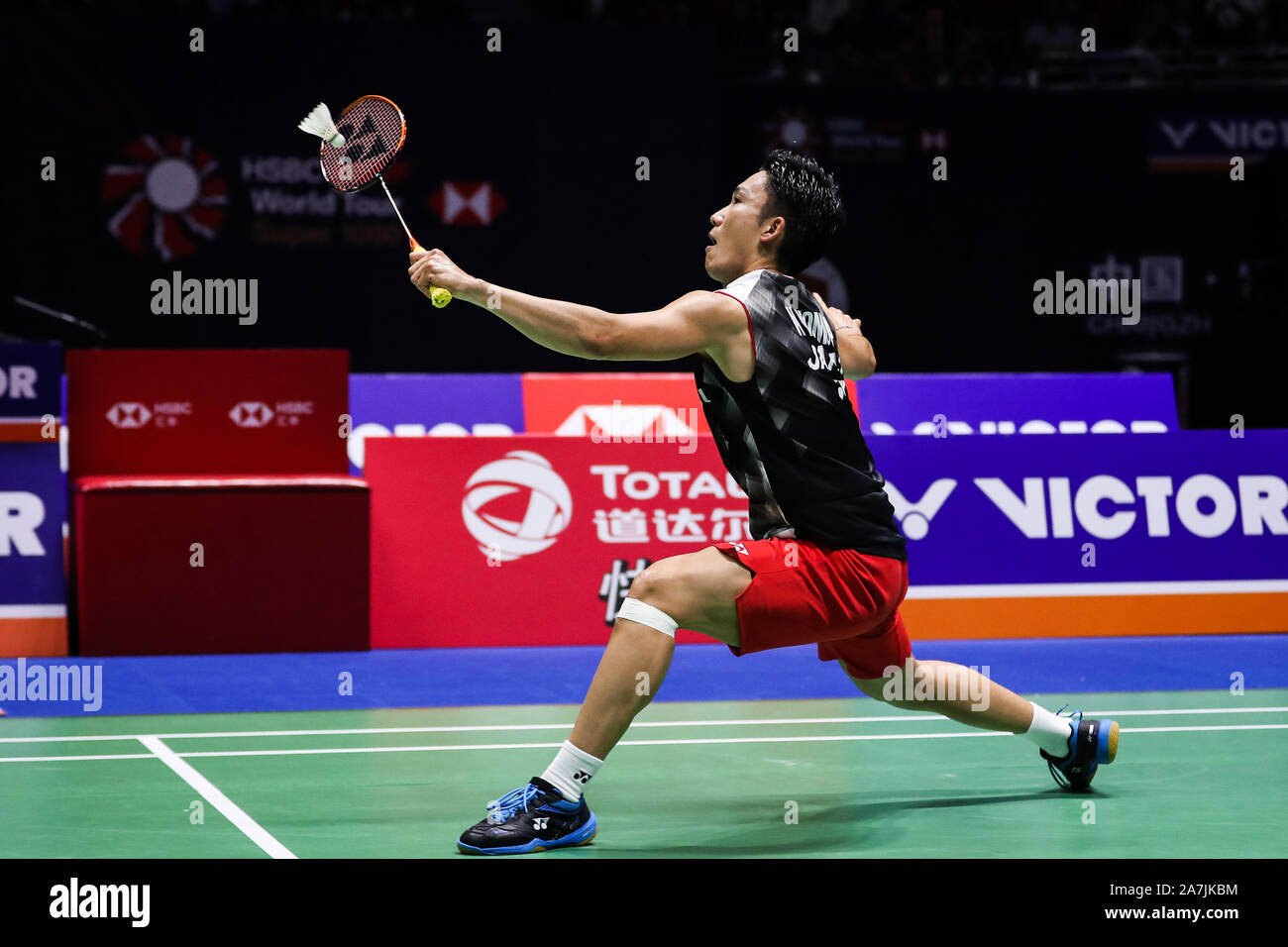 Japanese professional badminton player Kento Momota competes against ...
