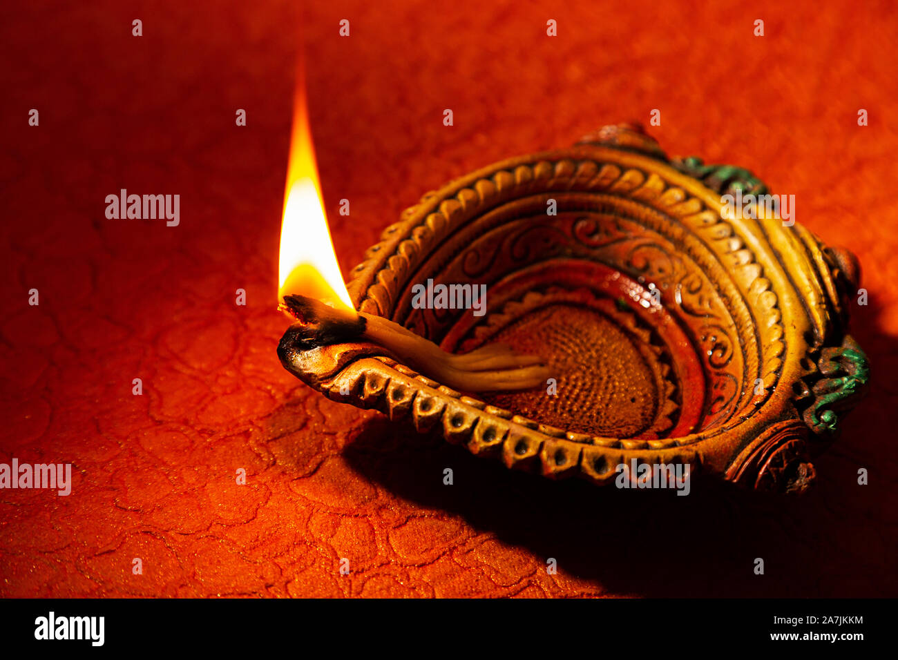Close-up lighting diya oil-lamp during Diwali Festival celebrations in ...