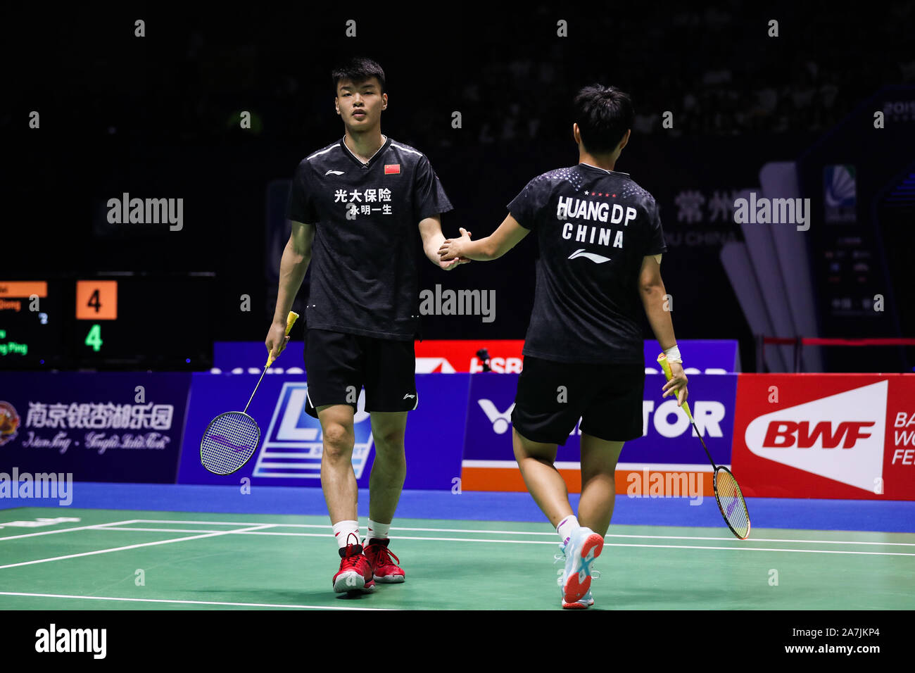 Chinese professional badminton players Wang Yilv and Huang Dongping ...