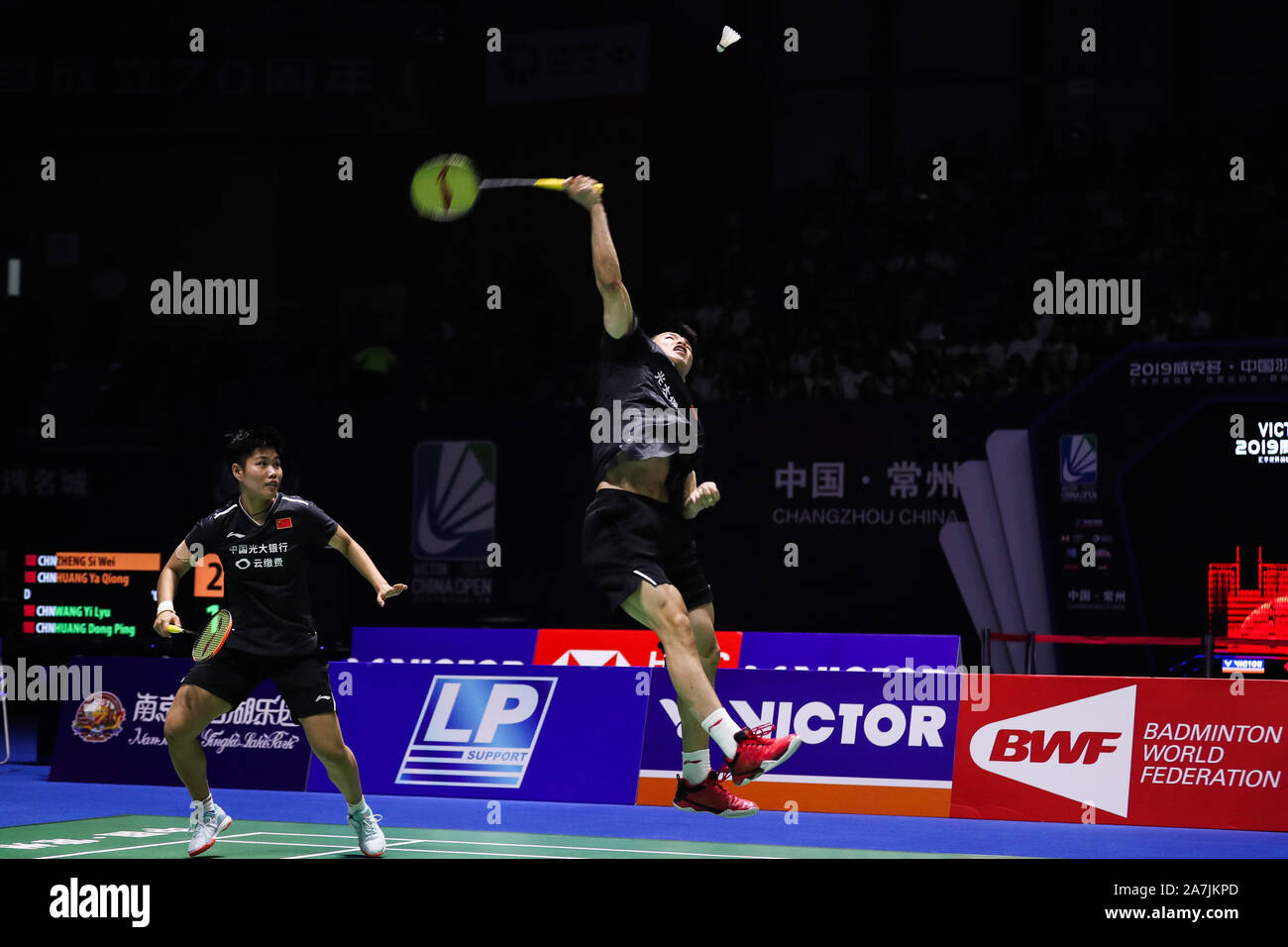 Chinese professional badminton players Wang Yilv and Huang Dongping ...