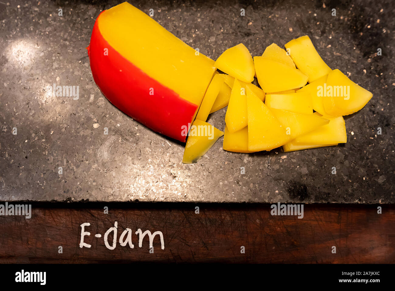 edam cheese on black stone plate in buffet line Stock Photo - Alamy