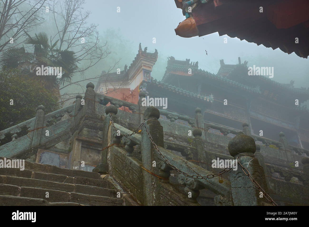 The steps of stair in ancient taoist martial arts wushu temple on foggy ...