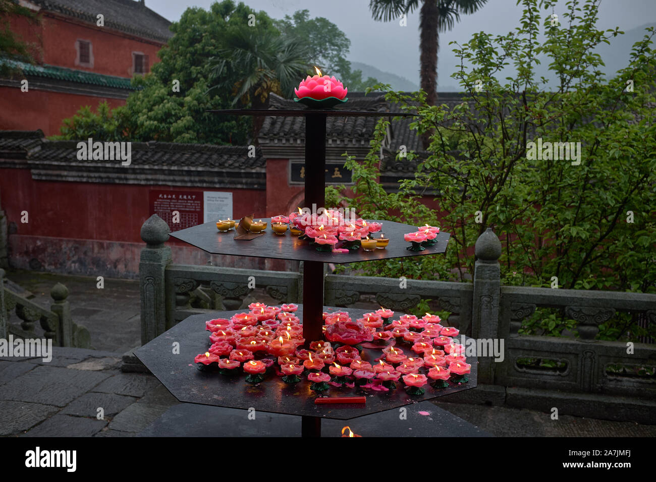 Lighting Candle in a Chinese taoist Temple background, selective focus ...
