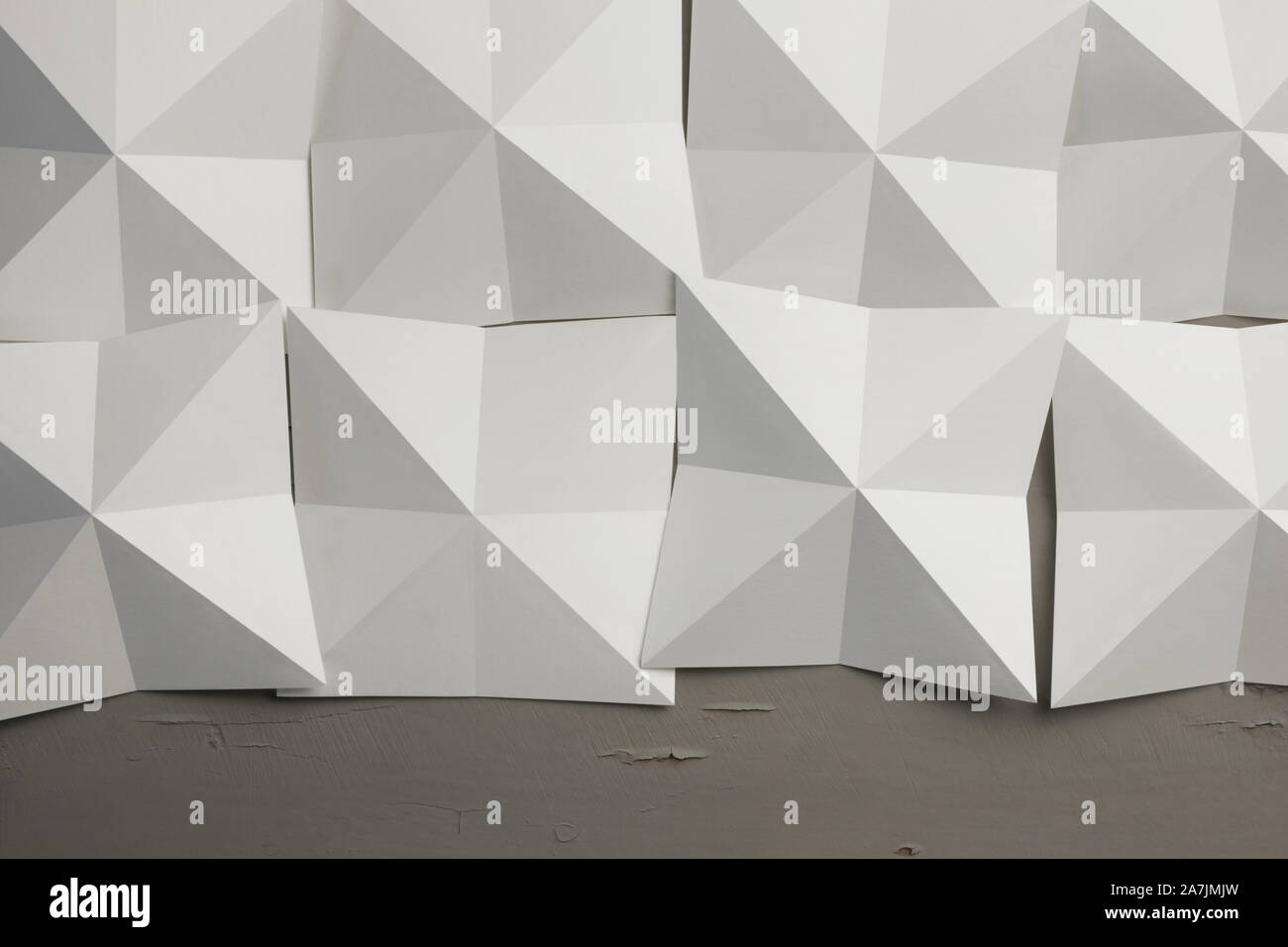 White paper folded in geometric shapes, abstract background Stock Photo ...
