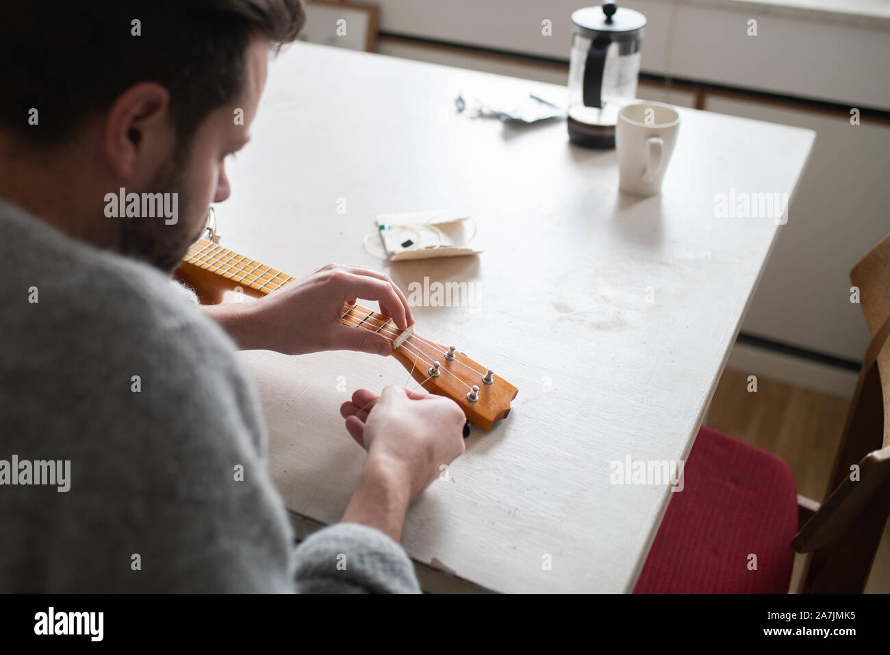 Man hand on strings hi-res stock photography and images - Alamy