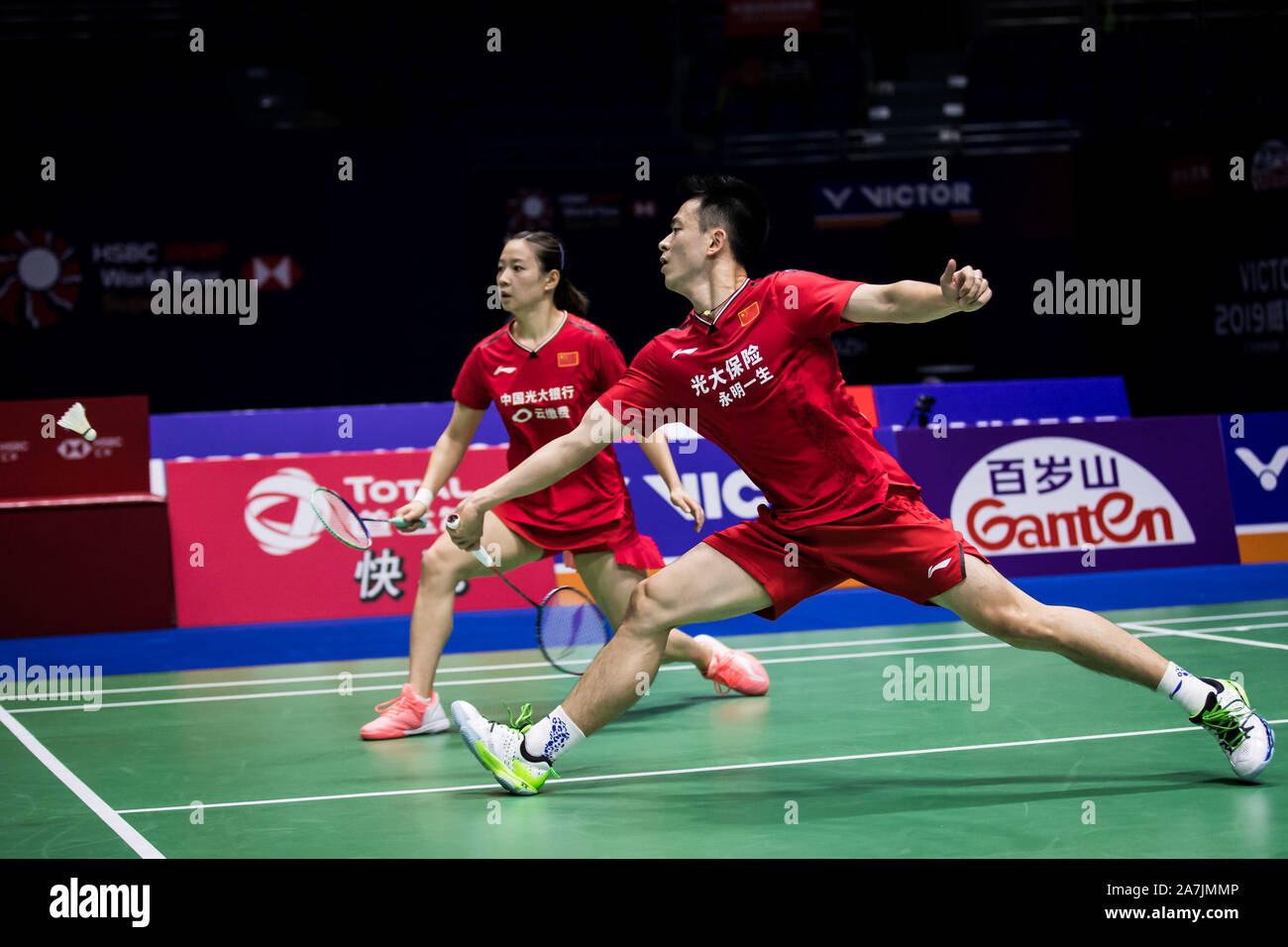Chinese professional badminton players Zheng Siwei and Huang Yaqiong compete against Japanese ...