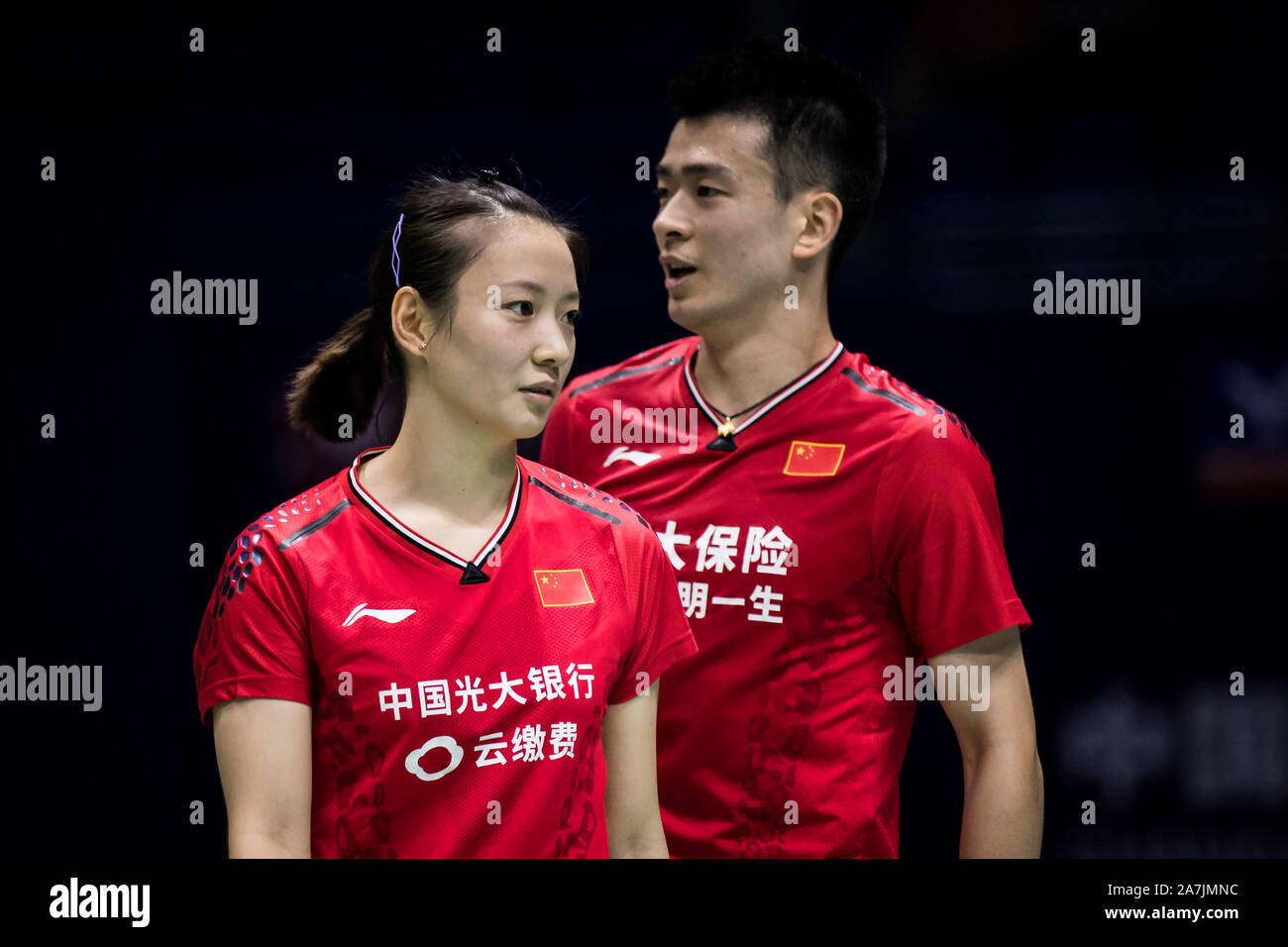 Chinese professional badminton players Zheng Siwei and Huang Yaqiong compete against Japanese ...