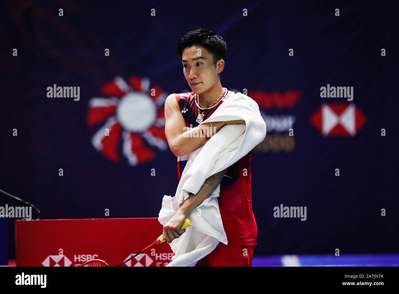 Japanese professional badminton player Kento Momota competes against ...