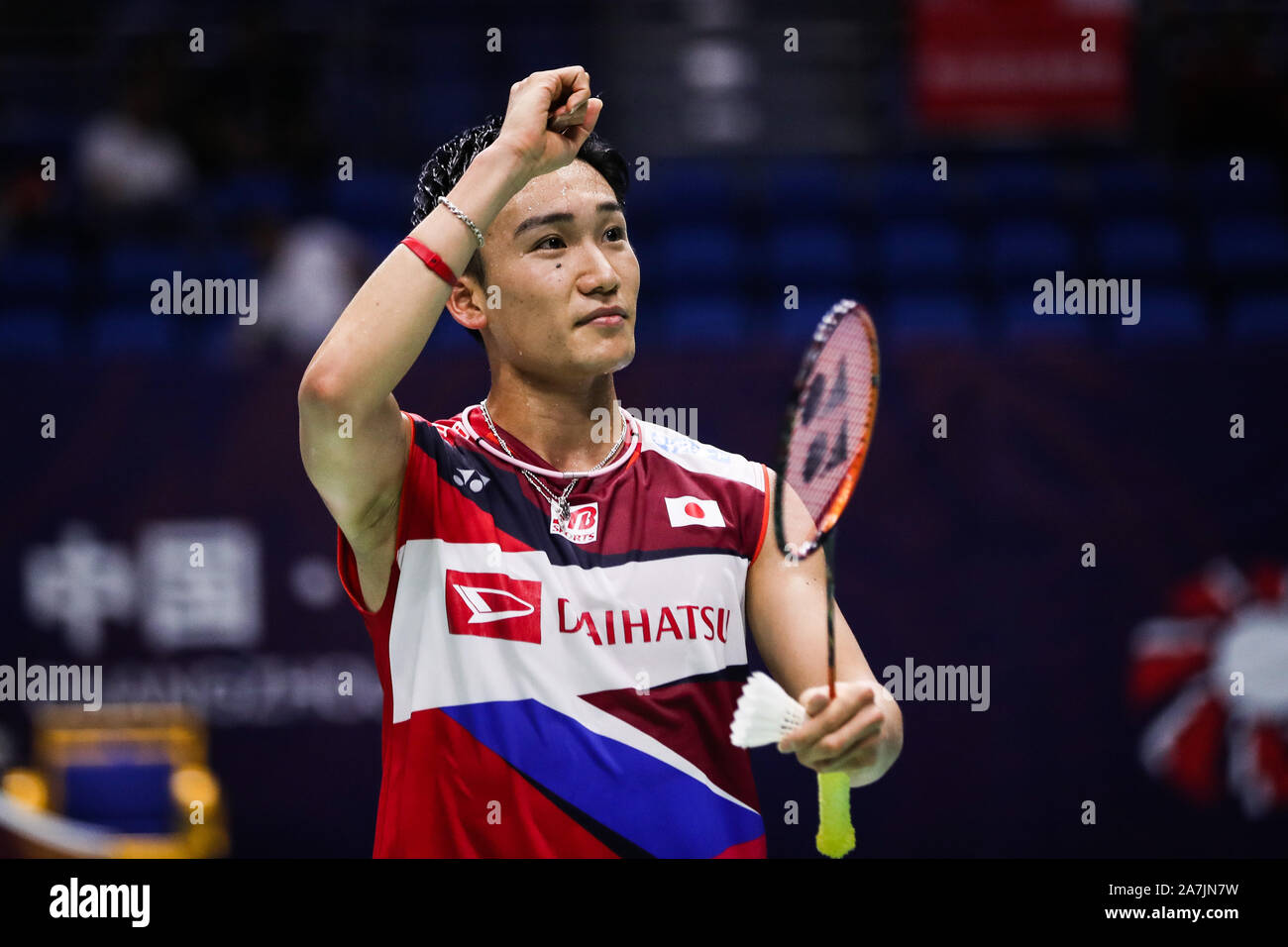 Japanese professional badminton player Kento Momota competes against ...