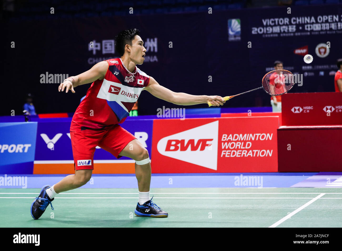 Japanese professional badminton player Kento Momota competes against ...