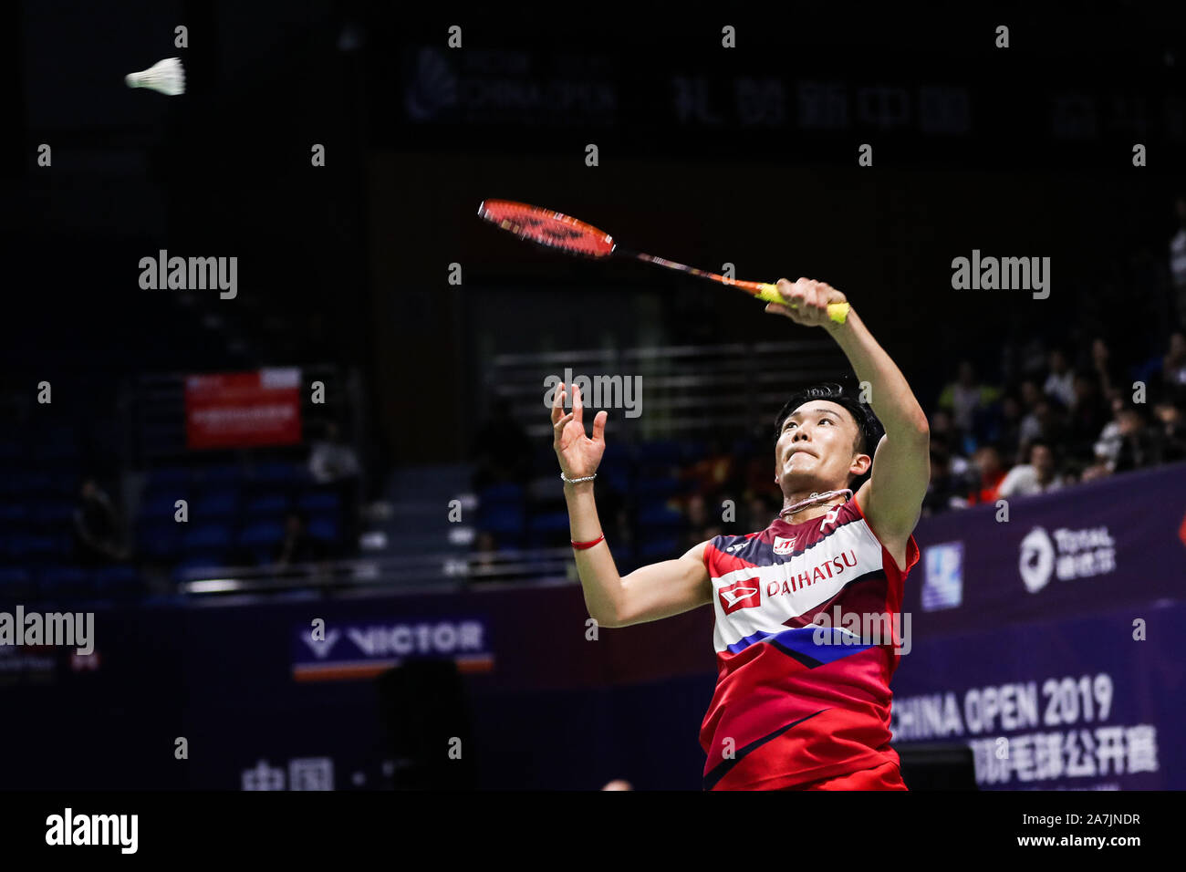 Japanese professional badminton player Kento Momota competes against ...