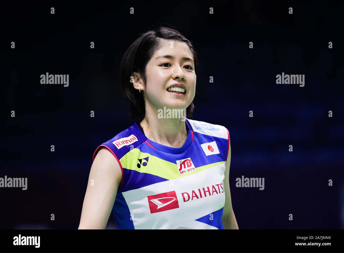 Chinese professional badminton players Wang Yilv and Huang Dongping compete against Japanese ...