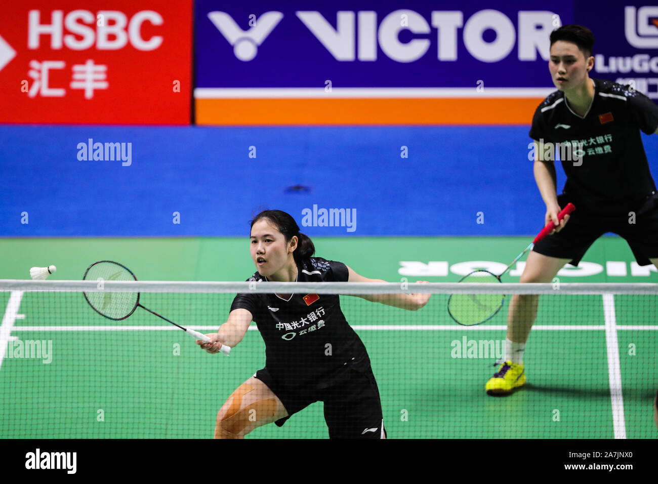 Chinese professional badminton players Li Wenmei and Zheng Yu compete ...