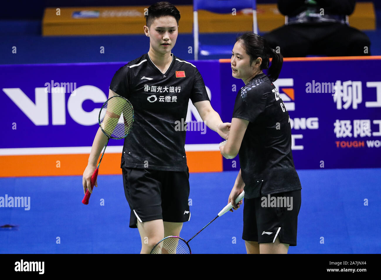 Chinese professional badminton players Li Wenmei and Zheng Yu compete ...