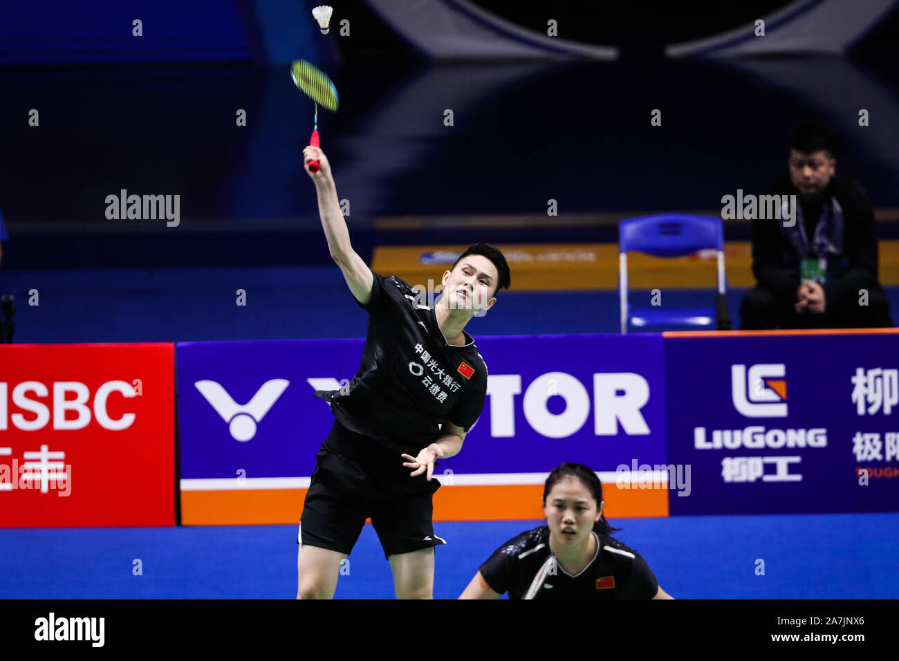 Chinese professional badminton players Li Wenmei and Zheng Yu compete ...