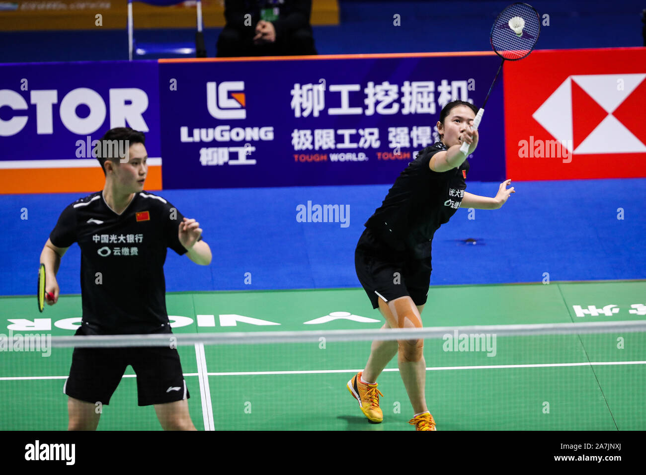Chinese professional badminton players Li Wenmei and Zheng Yu compete ...