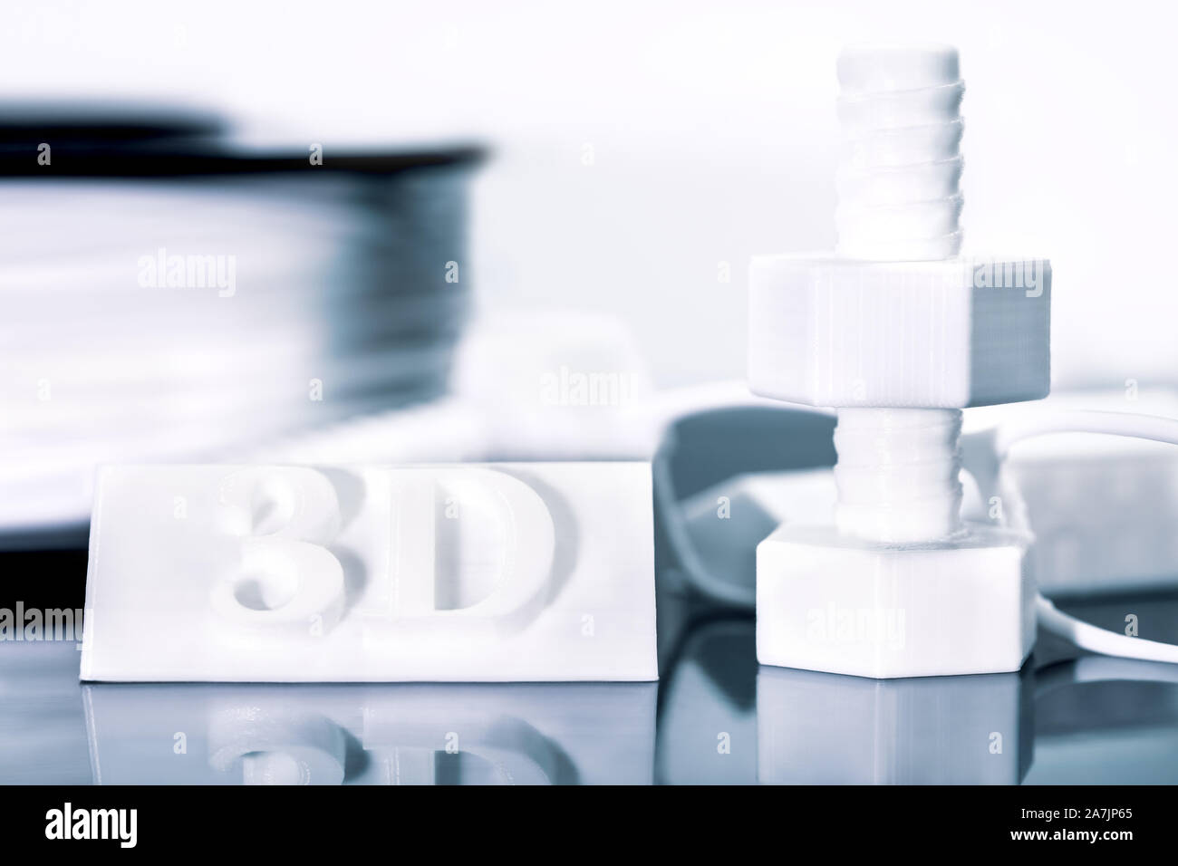 Various filament models from a 3D printer with reflection against a ...