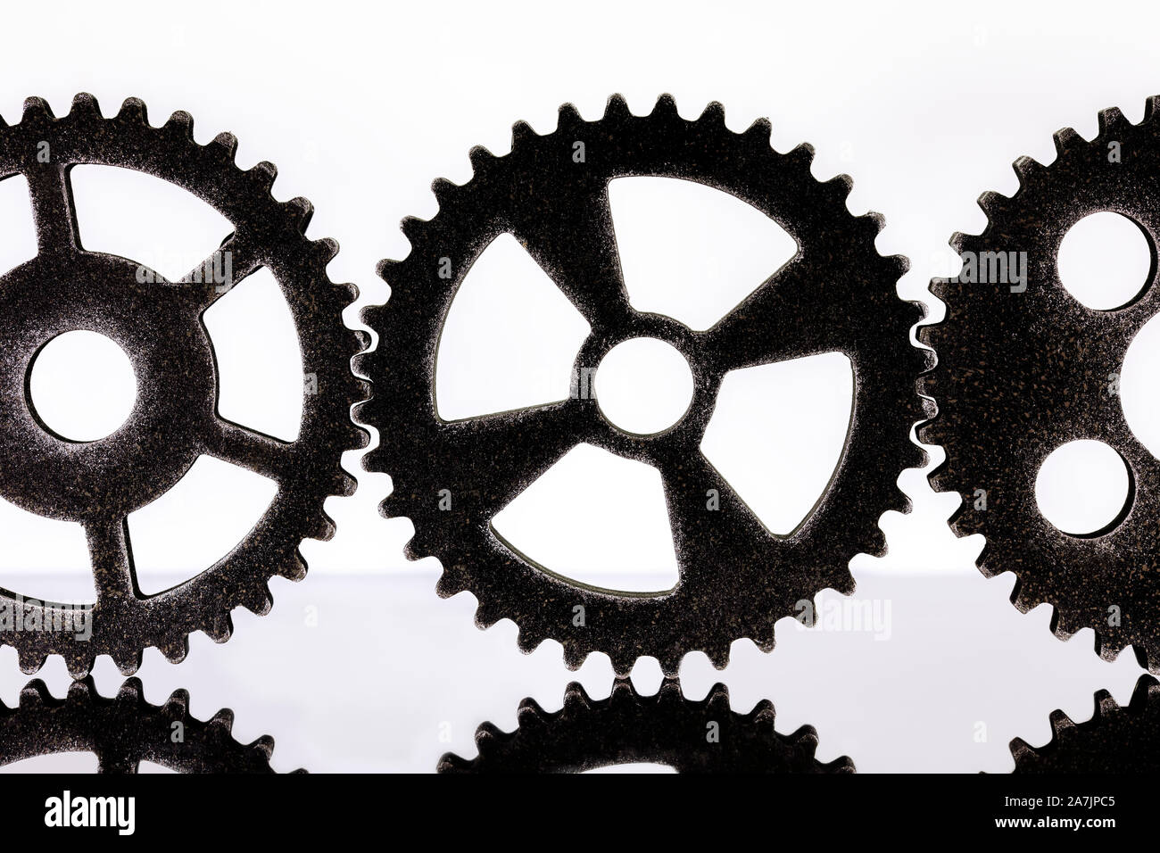 three gears in front of white background, concepts like teamwork or ...