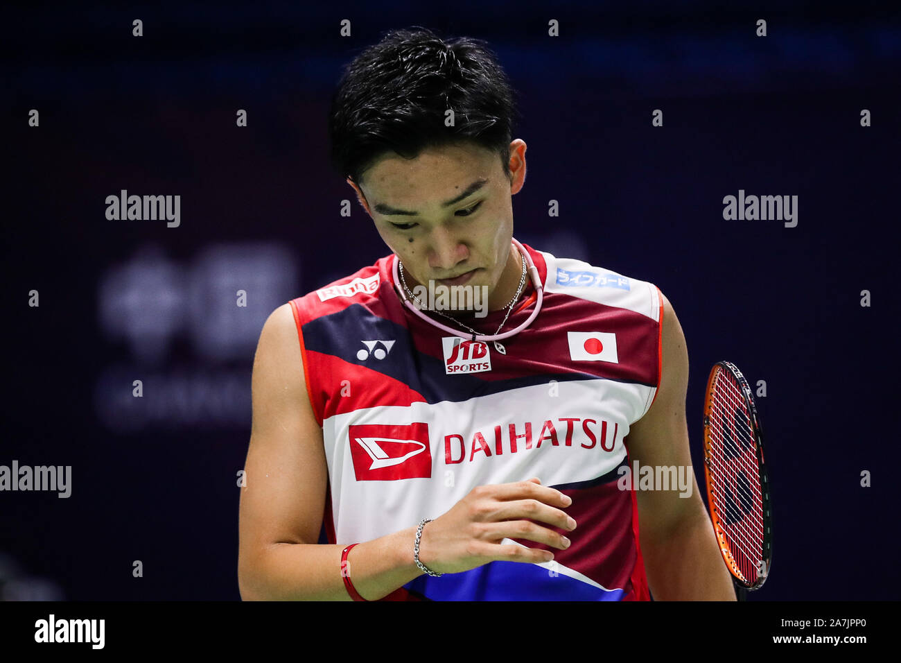 Japanese professional badminton player Kento Momota competes against ...