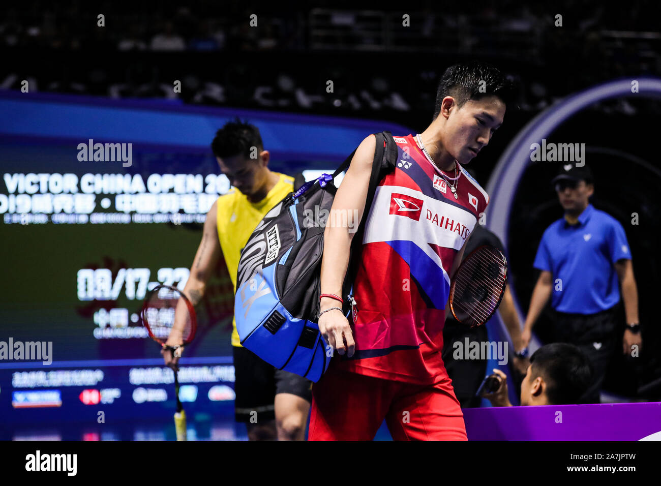 Chinese professional badminton player Lin Dan, left, competes against ...