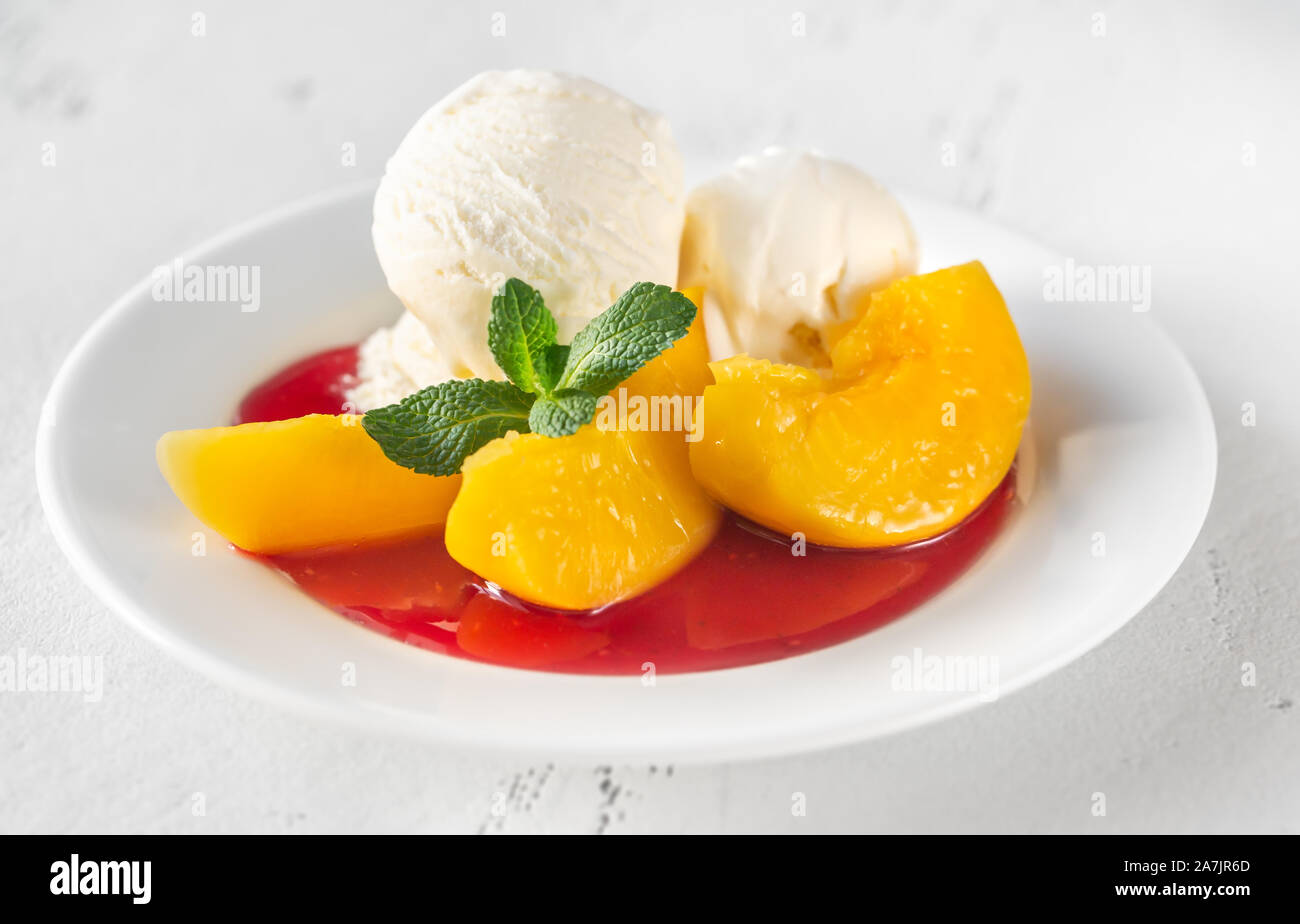 Peach Melba - dessert of peaches and raspberry sauce with vanilla ice ...