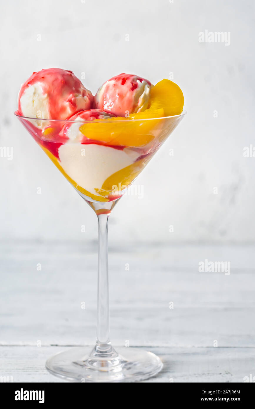Peach Melba - dessert of peaches and raspberry sauce with vanilla ice ...