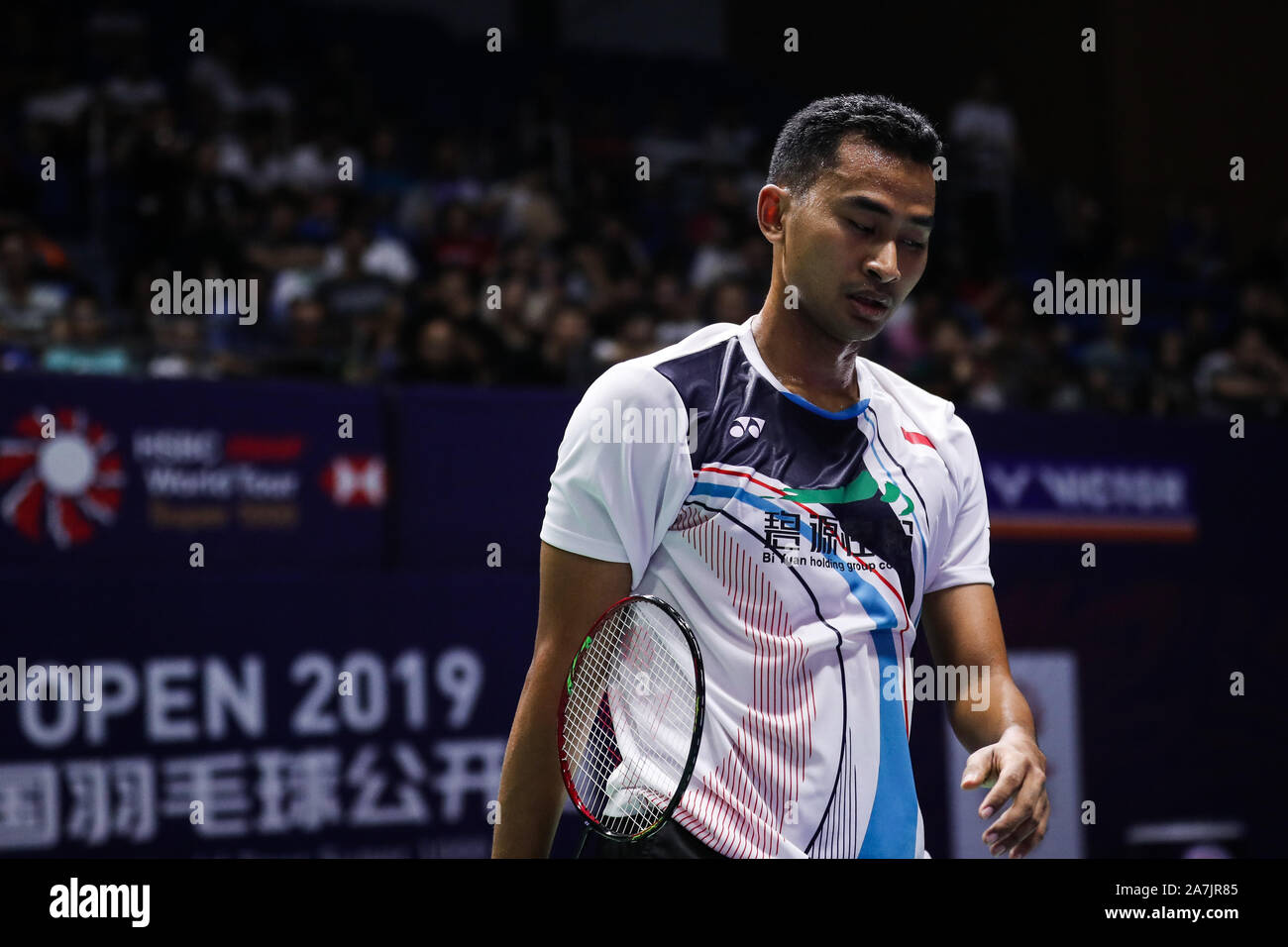 Hong Kong professional badminton player Wong Wing Ki competes against ...
