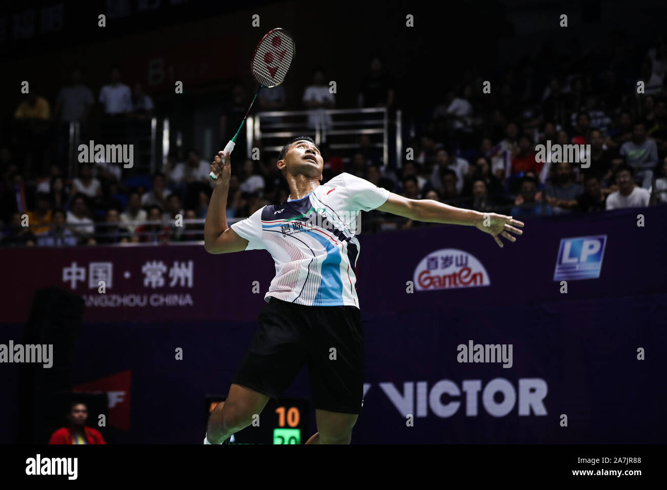 Hong Kong professional badminton player Wong Wing Ki competes against ...