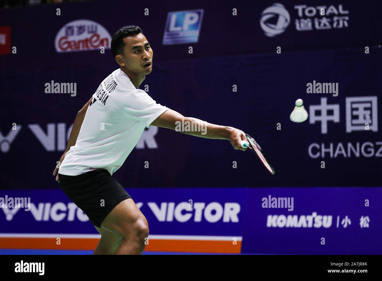 Hong Kong professional badminton player Wong Wing Ki competes against ...