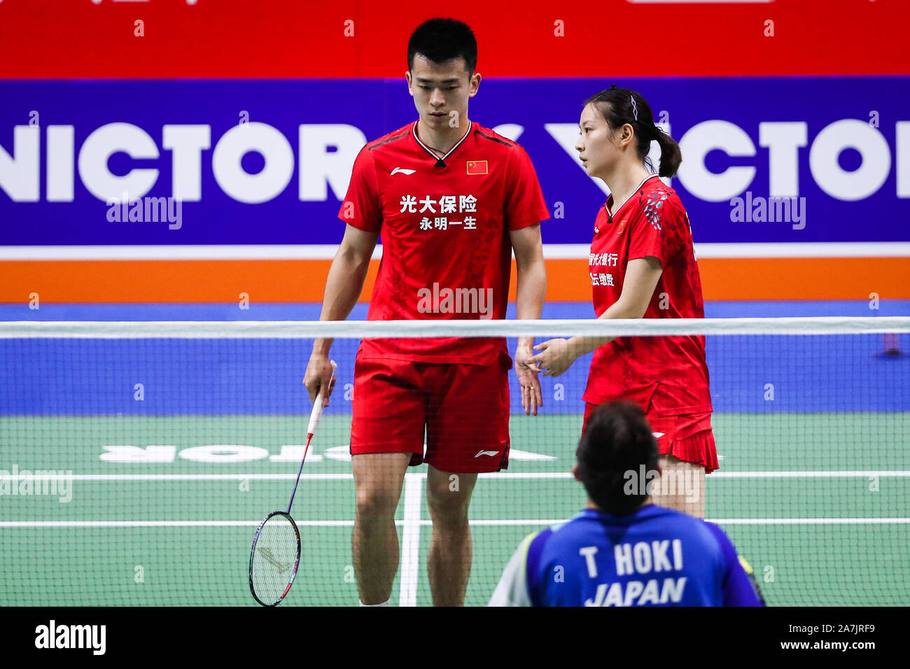 Chinese professional badminton players Zheng Siwei and Huang Yaqiong compete against Japanese ...