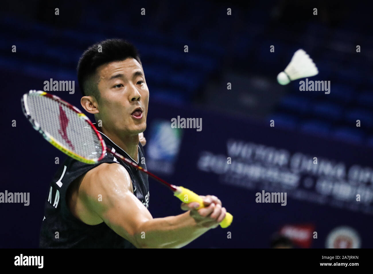 Chinese professional badminton player Chen Long competes against ...