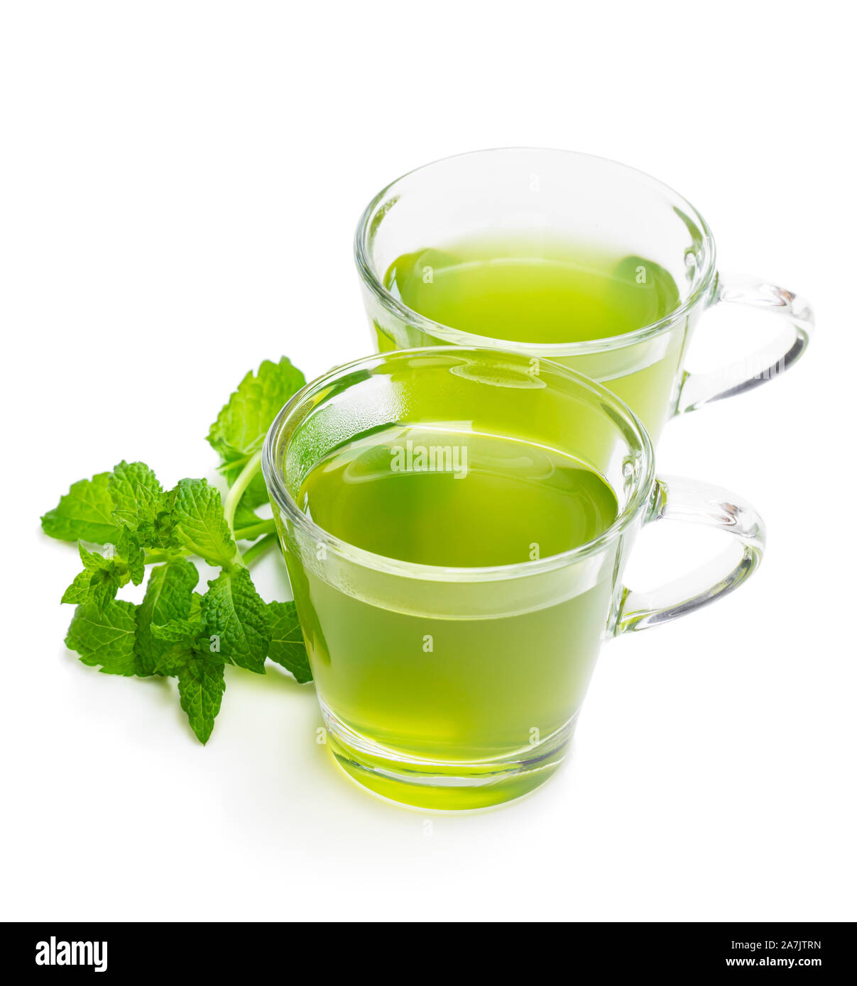 Green mint tea in clear glass cups isolated on white Stock Photo - Alamy