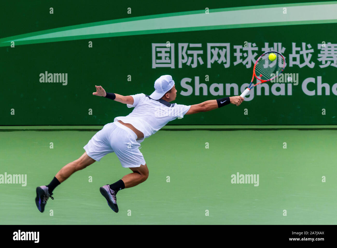 Chinese player Wu Di catches the ball at the Yasutaka Uchiyama vs Wu Di ...