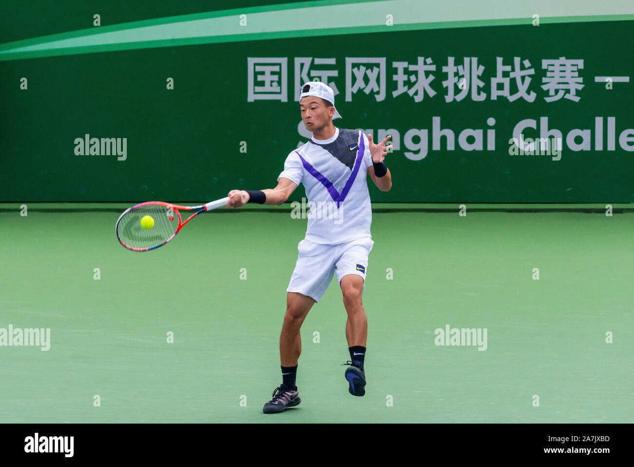 Chinese player Wu Di catches the ball at the Yasutaka Uchiyama vs Wu Di ...