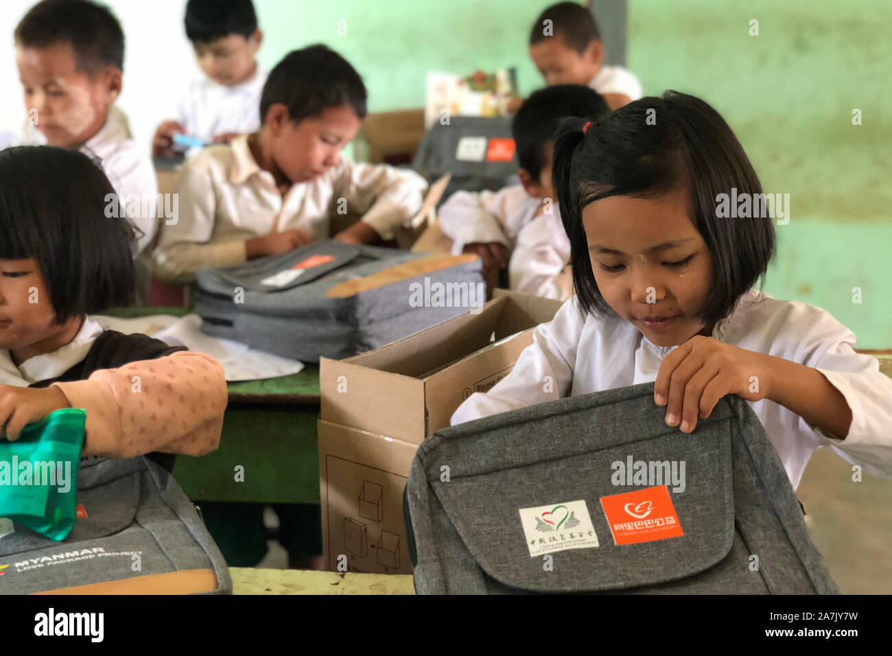 A child opens her backpack in Mingrau primary school in Shan state of ...